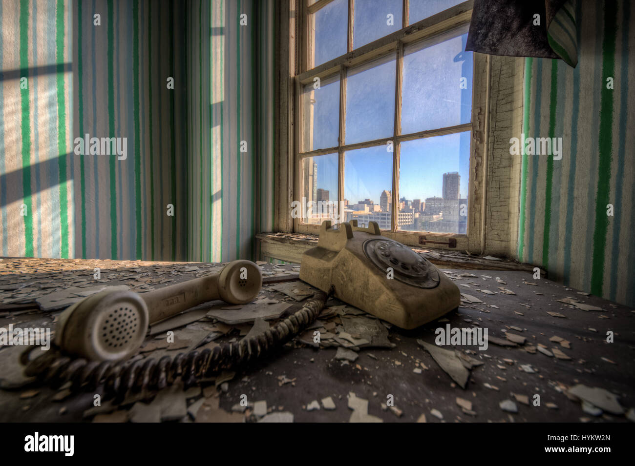 BIRMINGHAM, ALABAMA, USA: A phone lies off the hook in a forgotten room ...