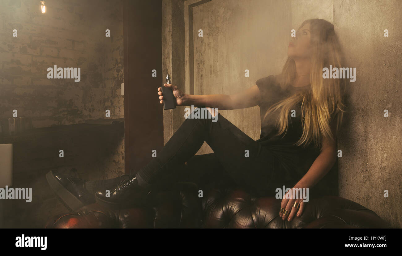 LONDON, UK: A female vaper relaxes. LIFTING the lid on UK underground ...