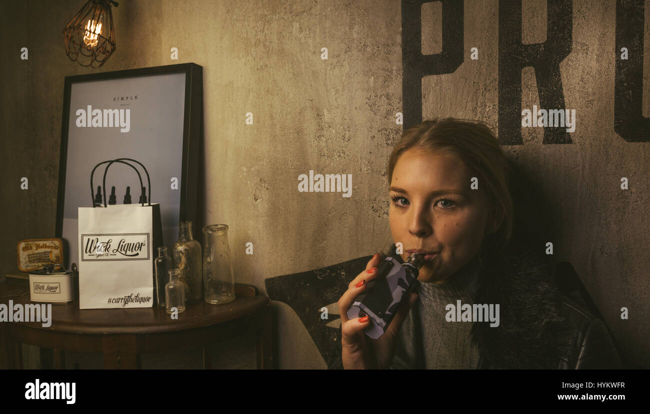 LONDON, UK: A female vaper relaxes. LIFTING the lid on UK underground ...