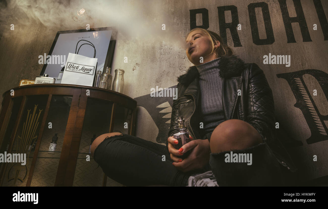 LONDON, UK: A female vaper relaxes. LIFTING the lid on UK underground ...