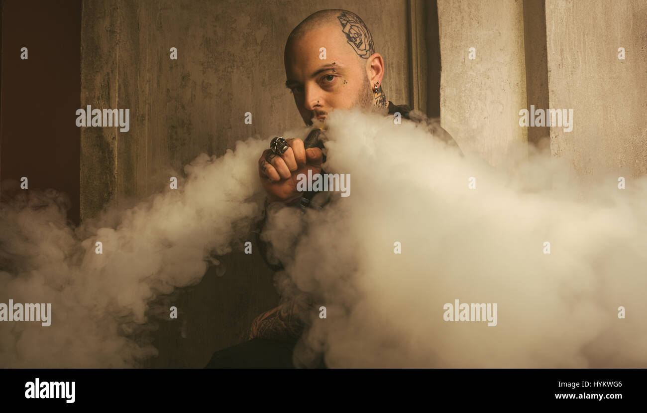 LONDON, UK: A male vaper breaths out. LIFTING the lid on UK underground ...