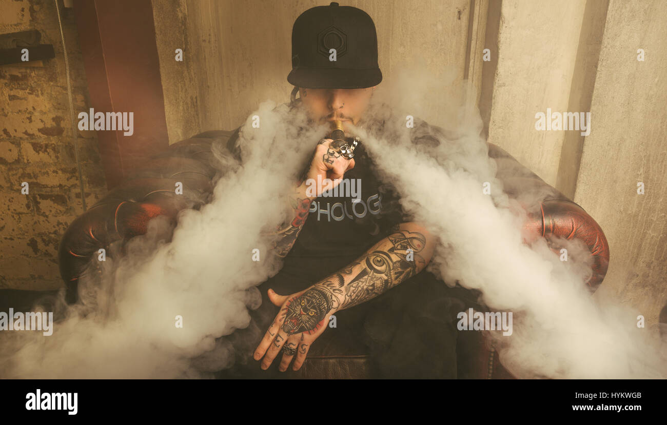 LONDON, UK: A male vaper breaths out. LIFTING the lid on UK underground ...