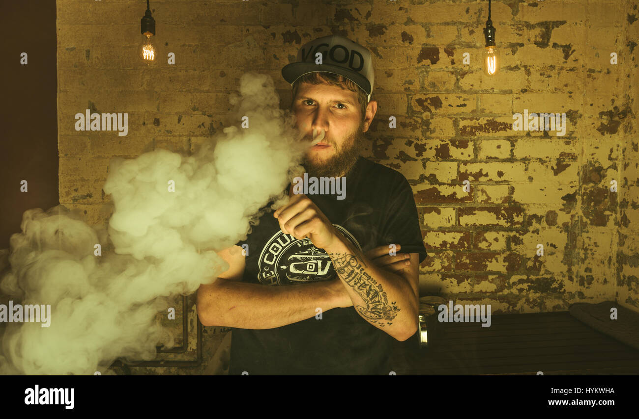 LONDON, UK: A male vaper breaths out. LIFTING the lid on UK underground ...