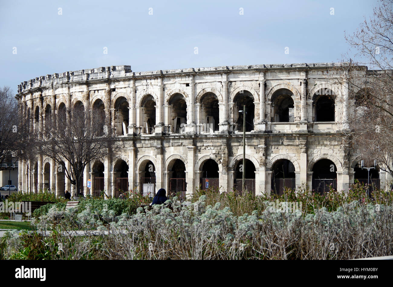 The Roman amphitheatre at Nimes, France, viewed from the gardens of the ...