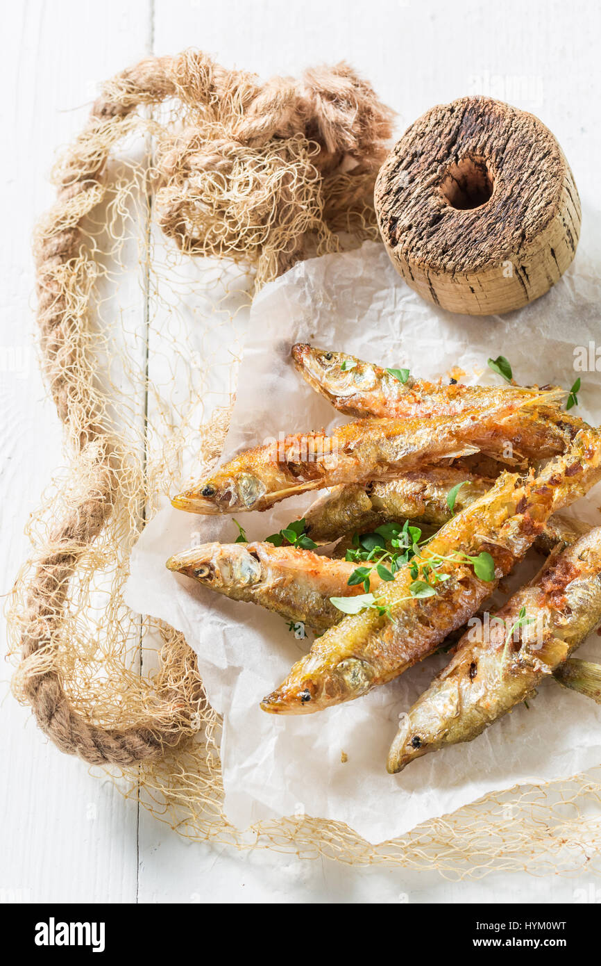 Fresh smelt fish and chips with herbs and salt Stock Photo - Alamy