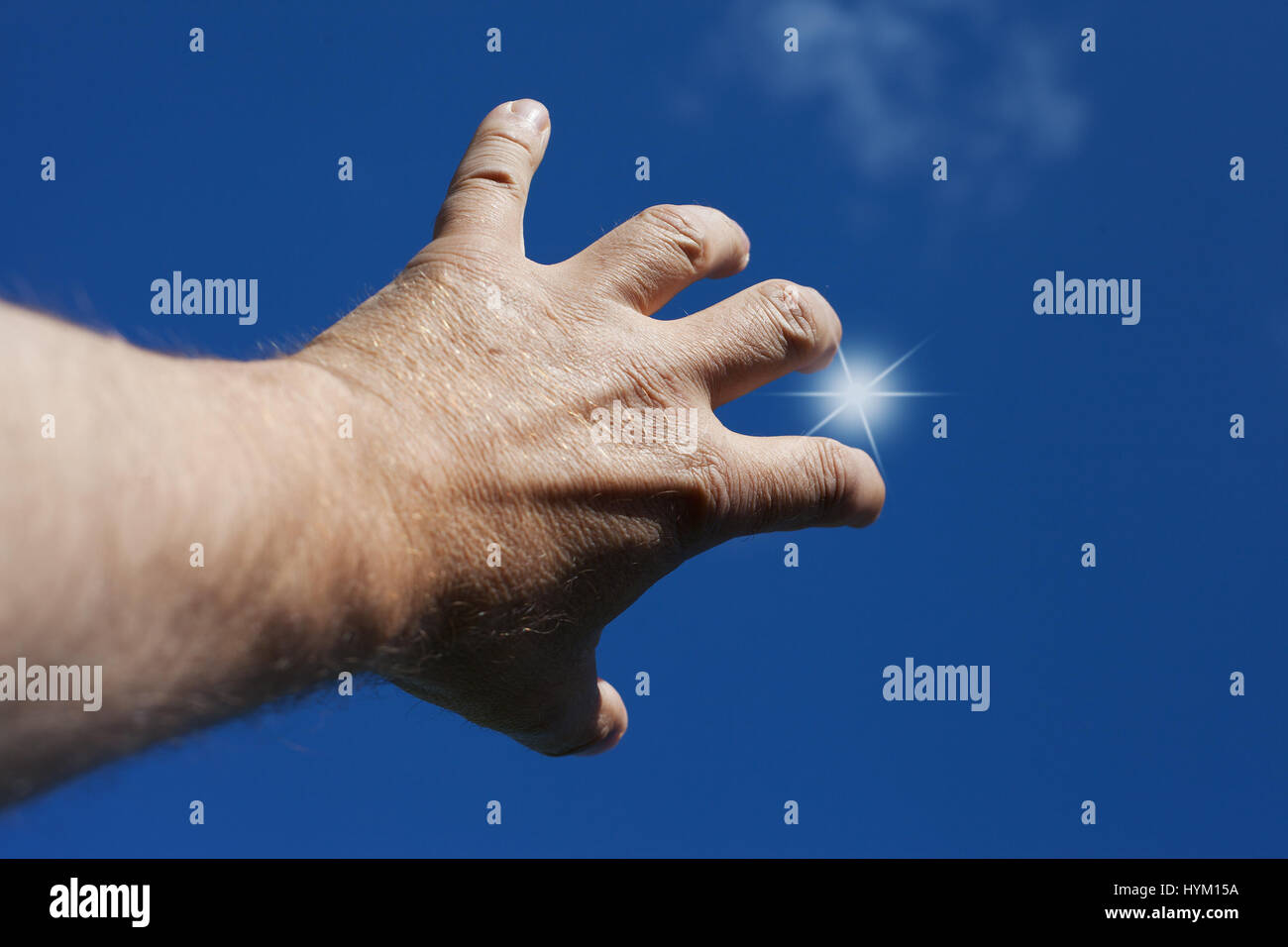 Hand and sun Stock Photo - Alamy