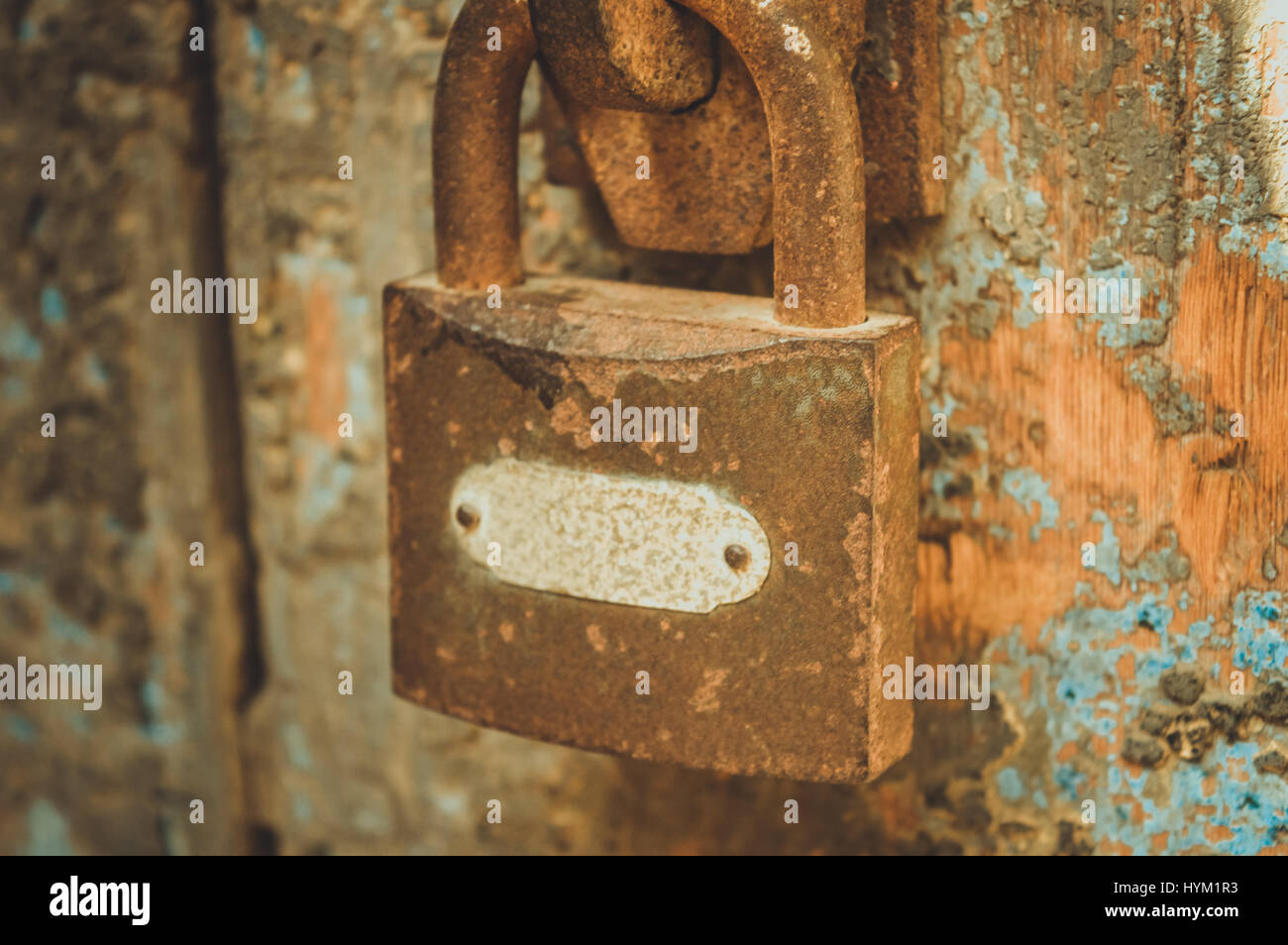closed lock on old door background Stock Photo - Alamy