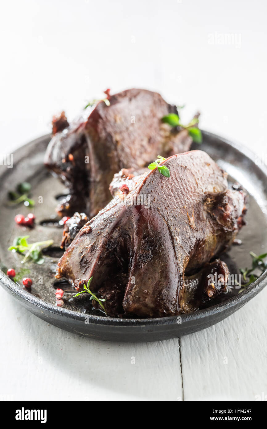Two roasted doves with spices and pepper Stock Photo - Alamy