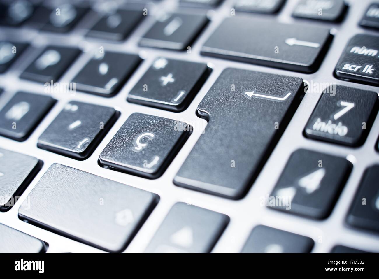 Forefront of a gray laptop keyboard Stock Photo - Alamy