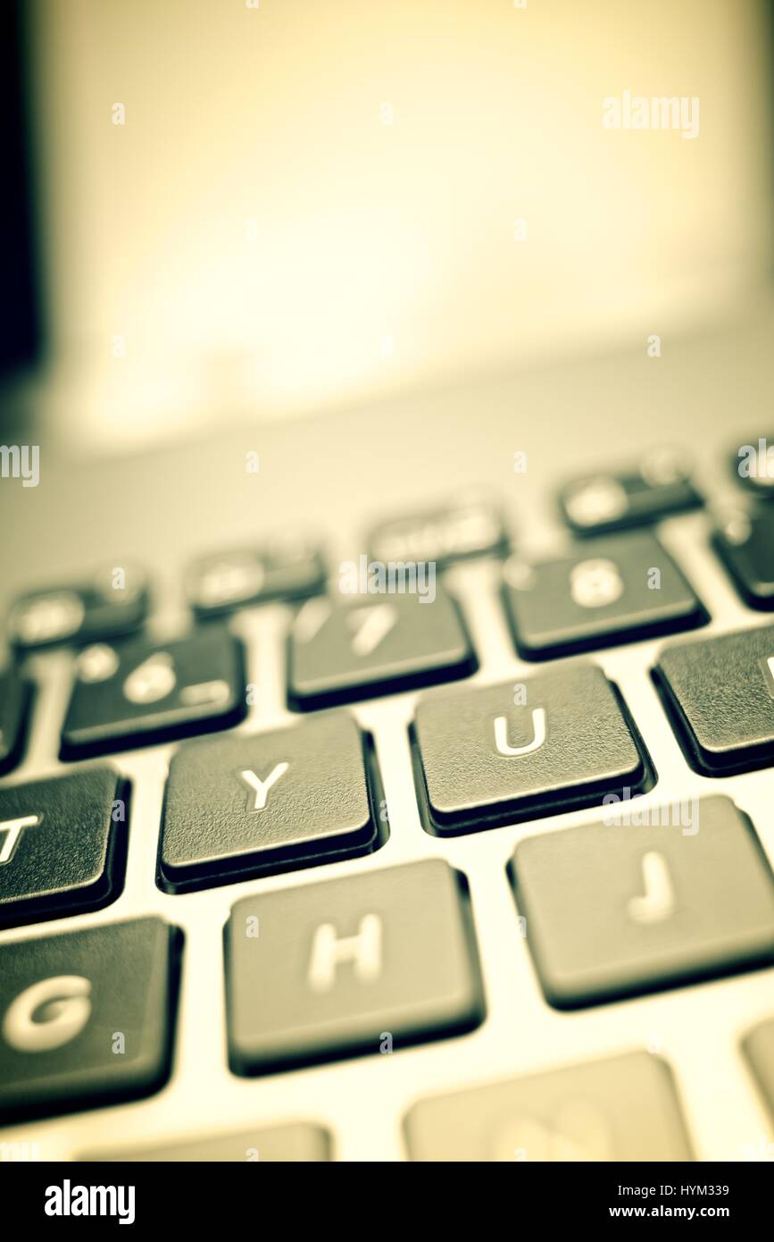 Forefront of a gray laptop keyboard Stock Photo - Alamy