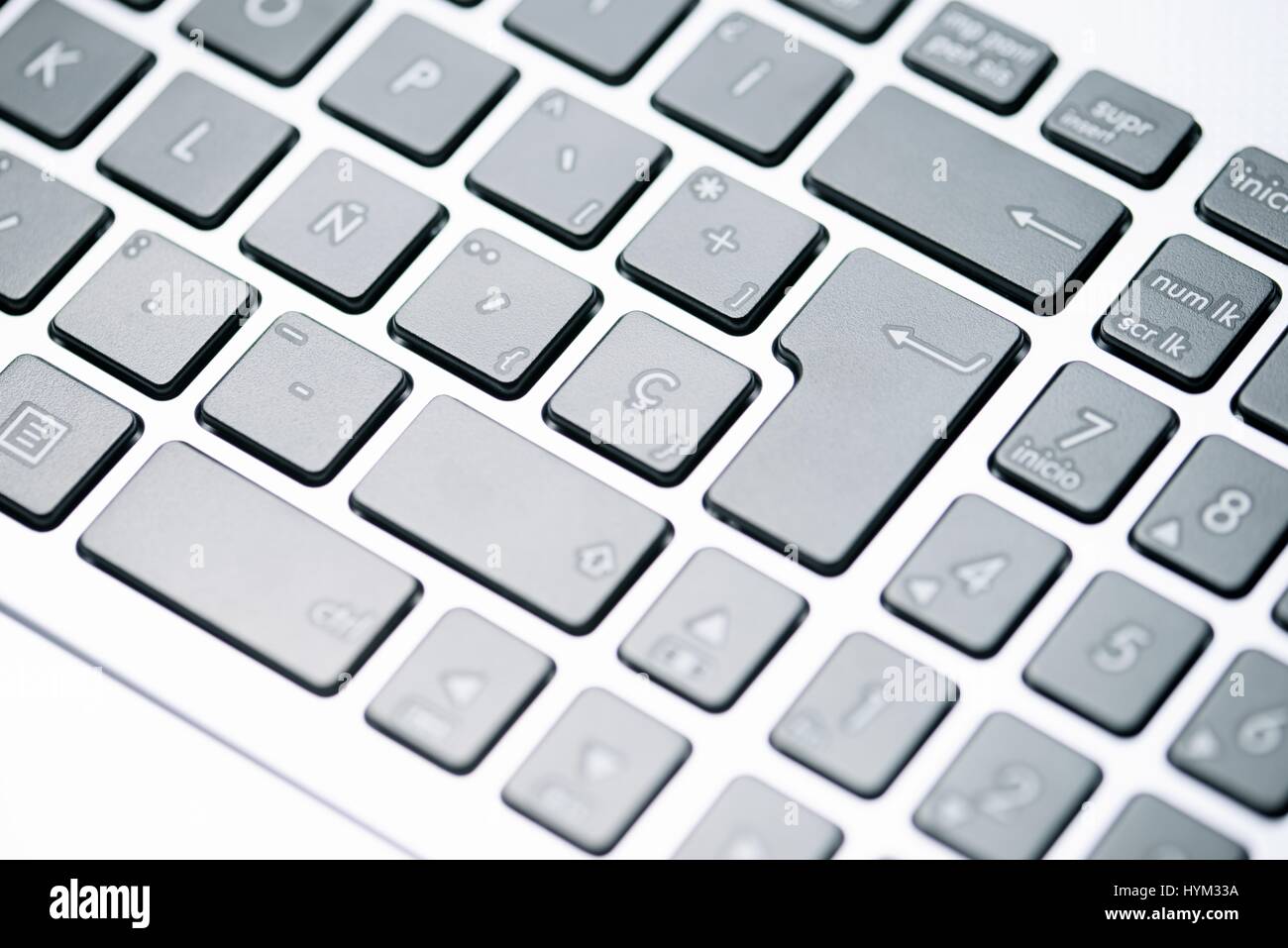 Forefront of a gray laptop keyboard Stock Photo - Alamy
