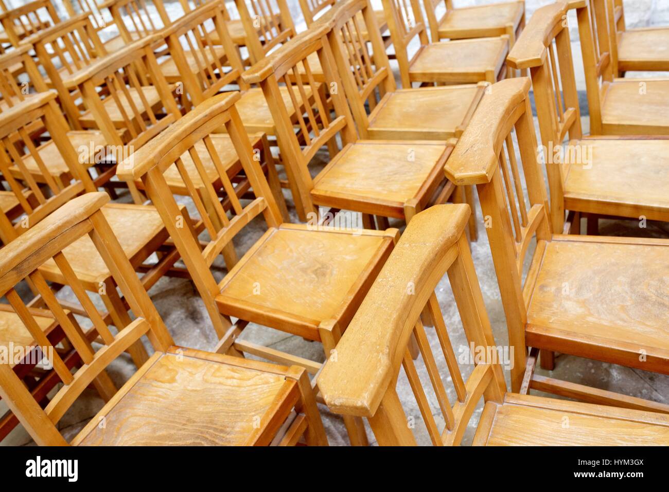 Huge group of wooden chairs arranged in rows Stock Photo - Alamy