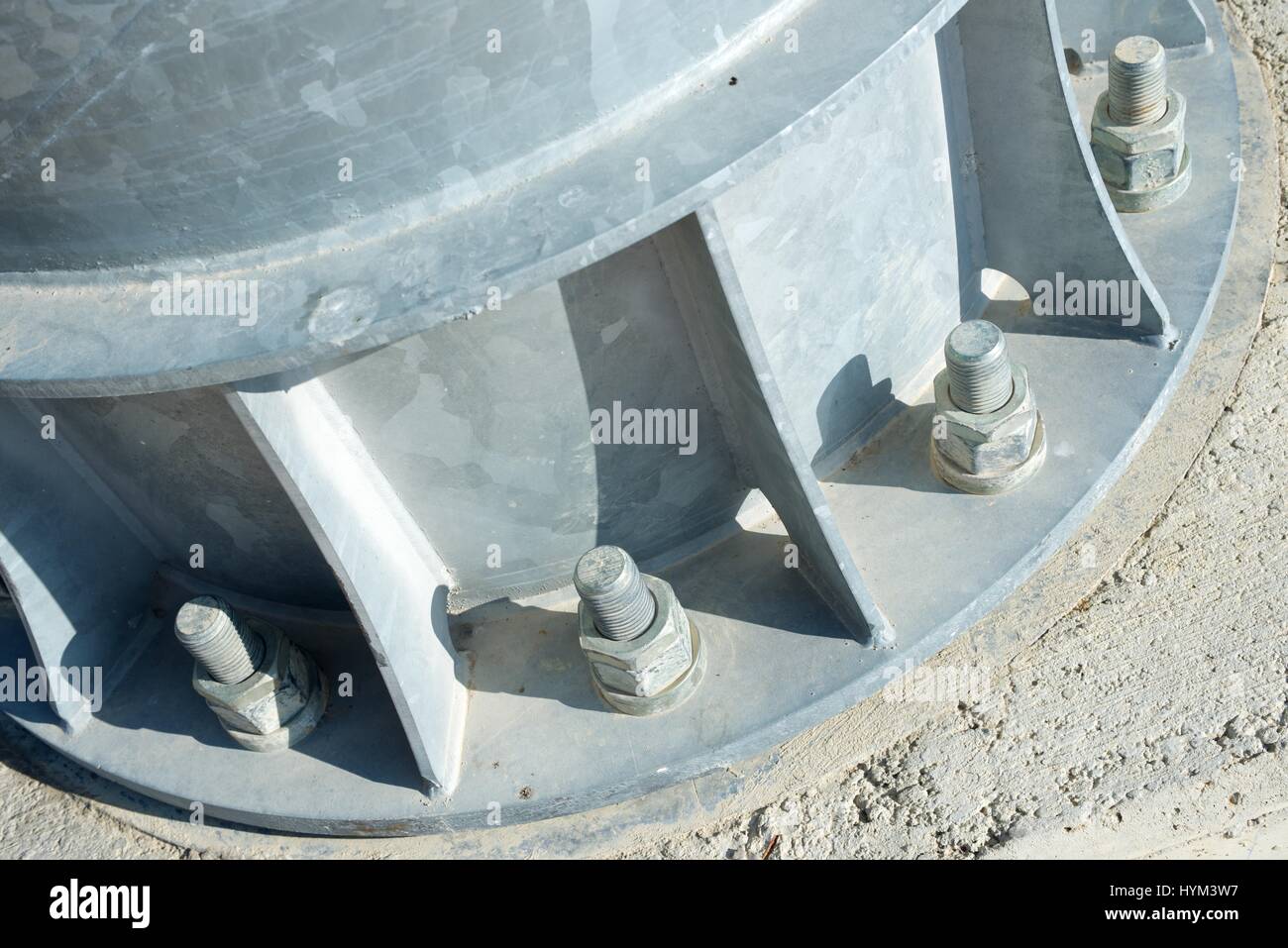Close up of some larger screws into the base of a metal pillar Stock ...