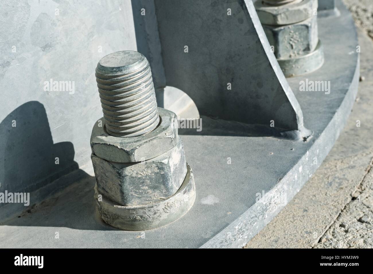 Close up of some larger screws into the base of a metal pillar Stock ...