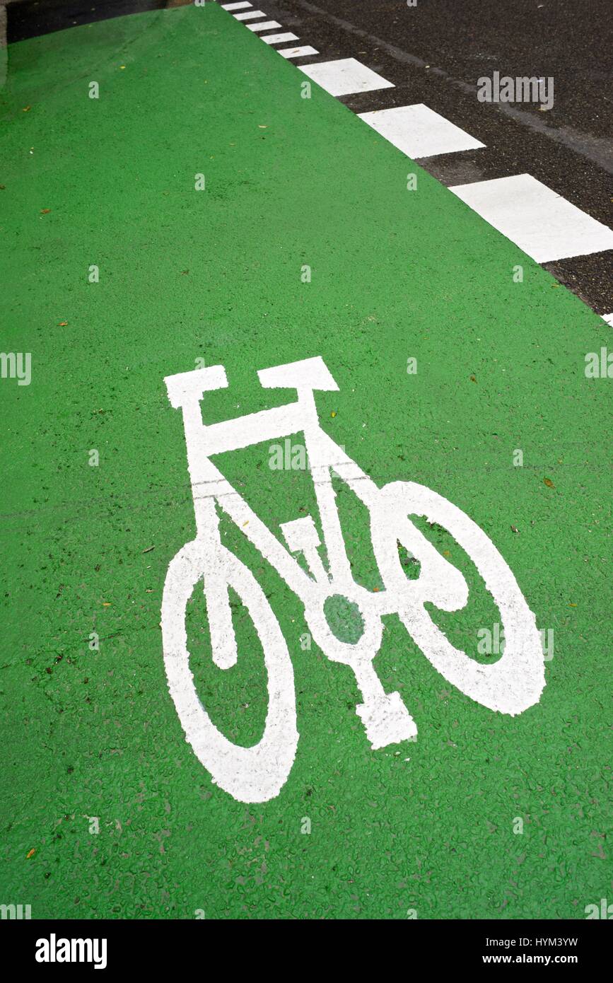 Bike lane sign painted on a street Stock Photo - Alamy