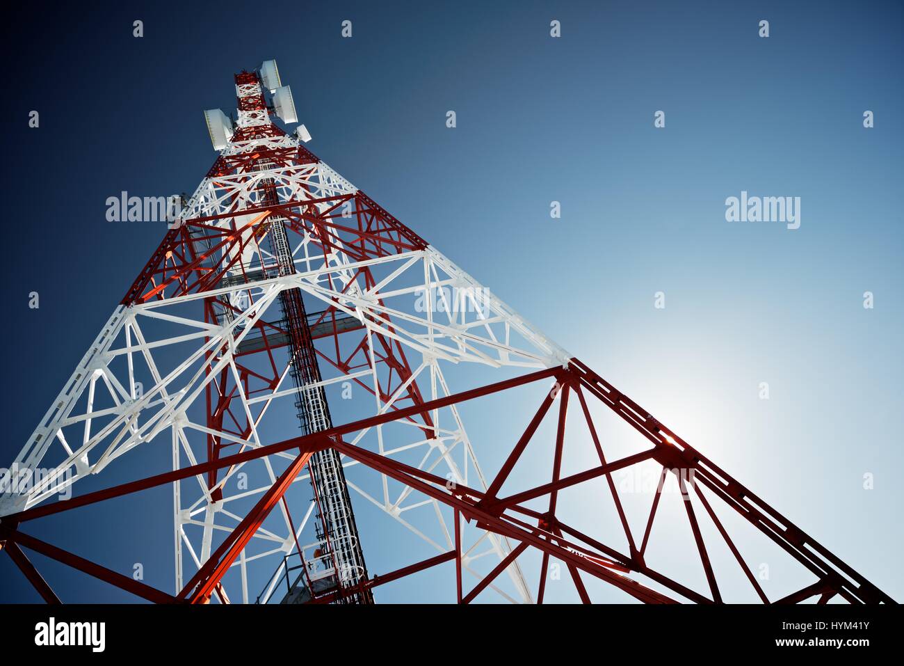 Telecommunications tower with clear blue sky Stock Photo - Alamy