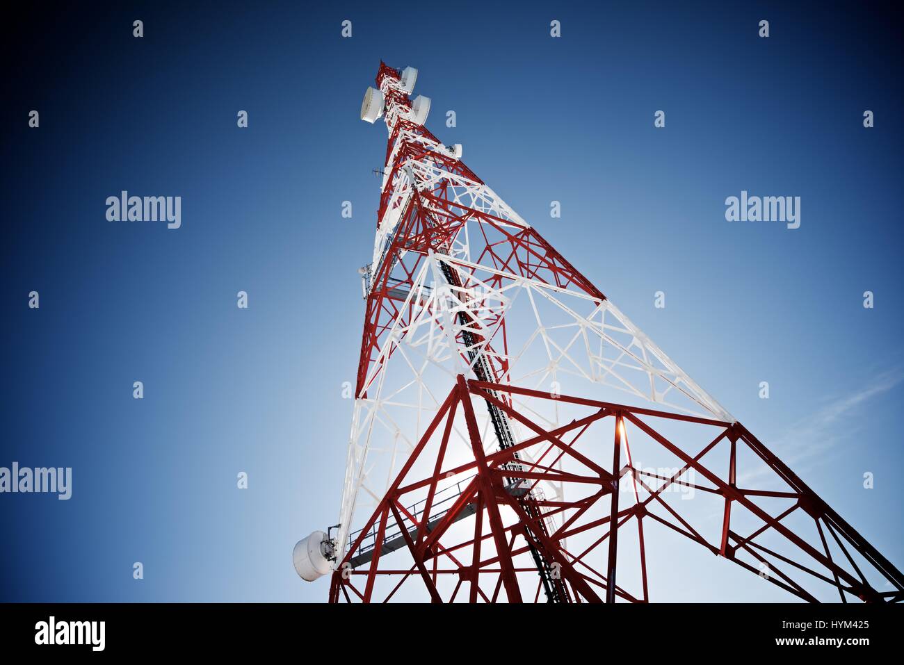 Telecommunications tower with clear blue sky Stock Photo - Alamy