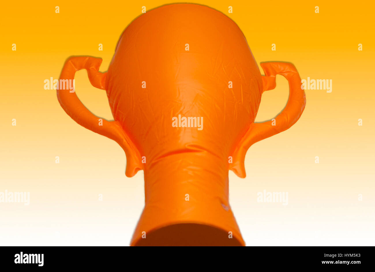 An orange trophy isolated on an orange and white background Stock Photo ...