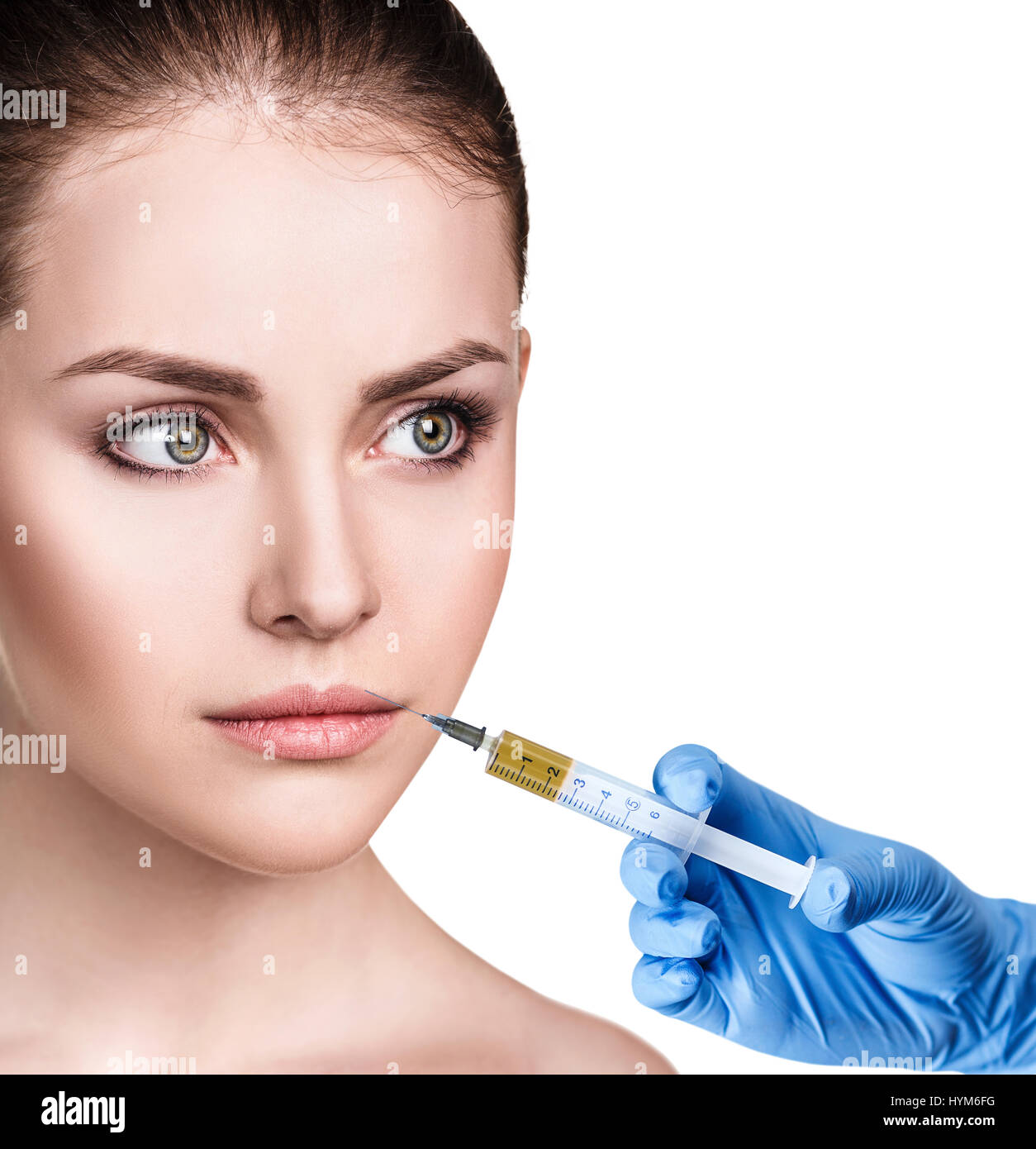 Young woman getting cosmetics injection Stock Photo - Alamy
