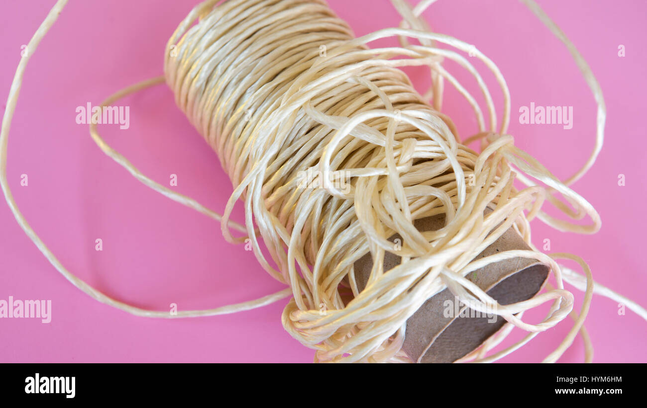 pink table with roll of rope Stock Photo - Alamy