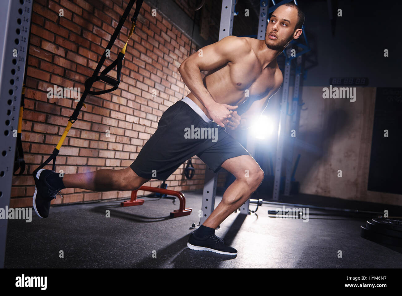 Male athlete doing stretching exercises Stock Photo - Alamy