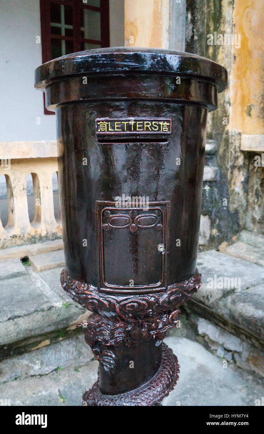 Vintage old dark metal postal mailbox in China Stock Photo - Alamy