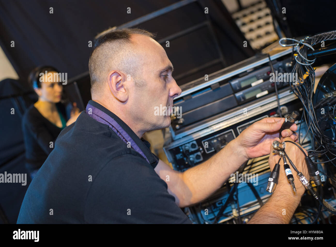 Soundman connecting up equipment hi-res stock photography and images ...