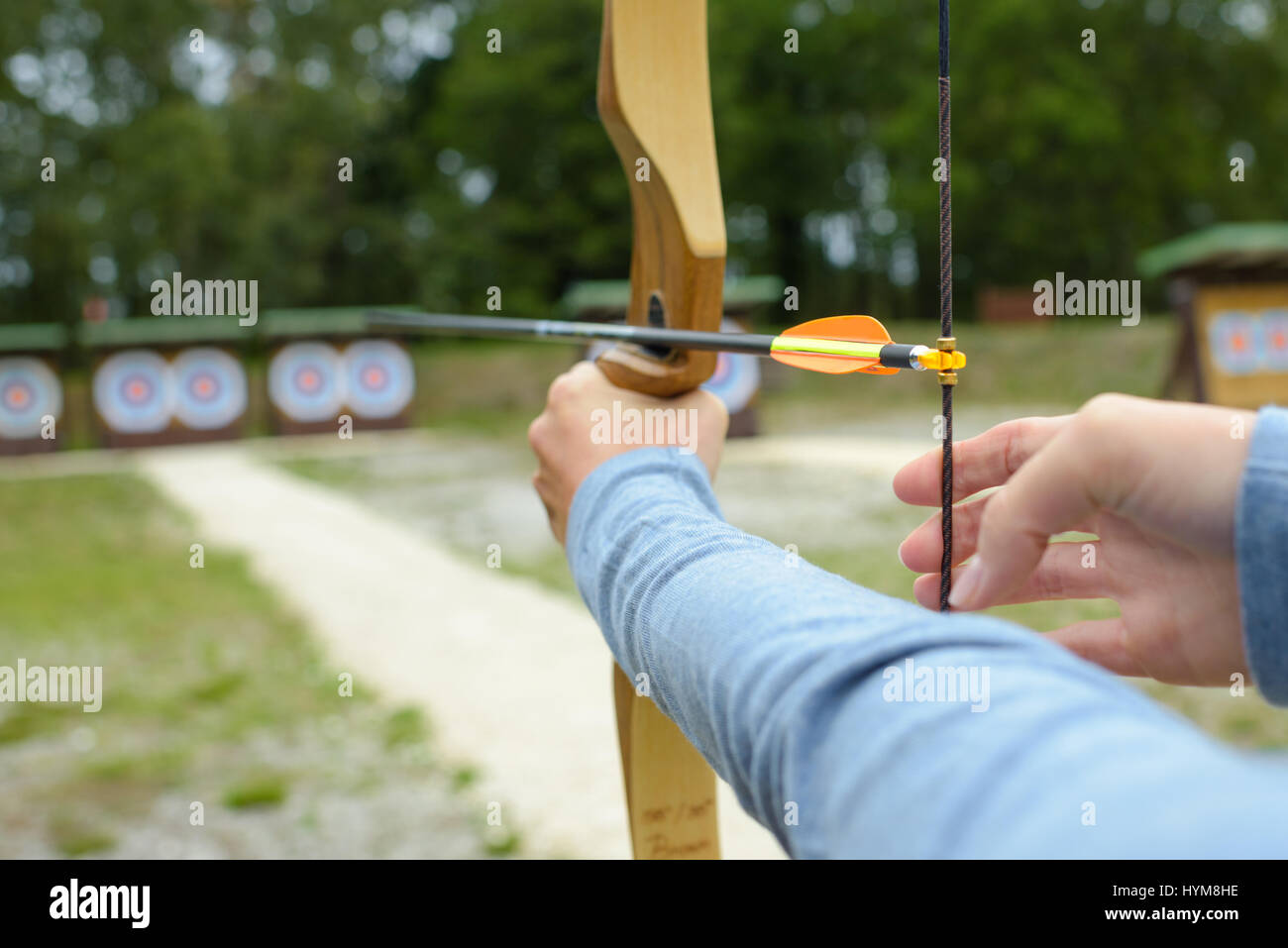 pulling the arrow Stock Photo - Alamy