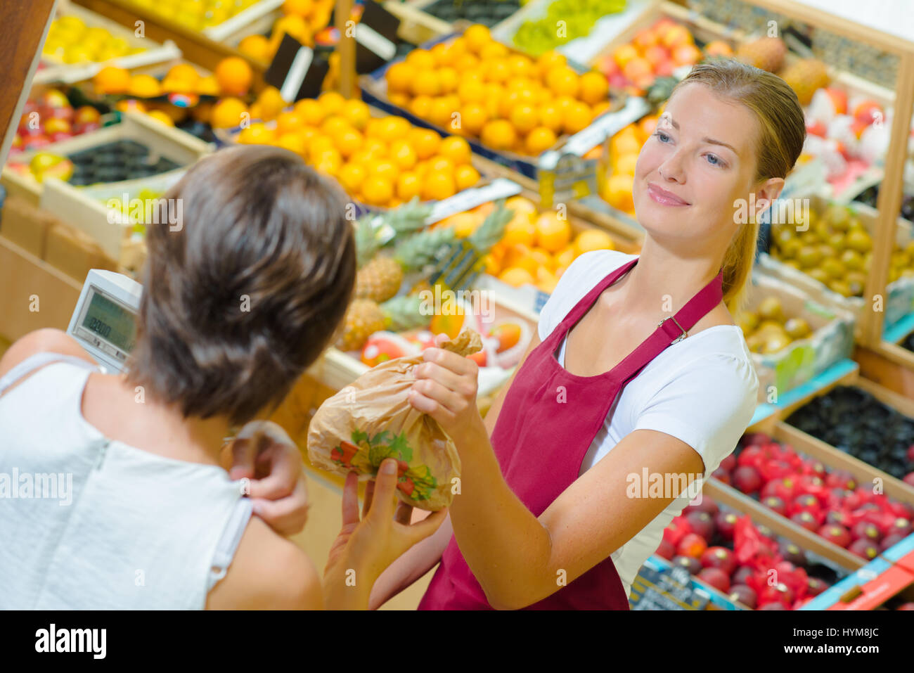 giving the fruits Stock Photo - Alamy