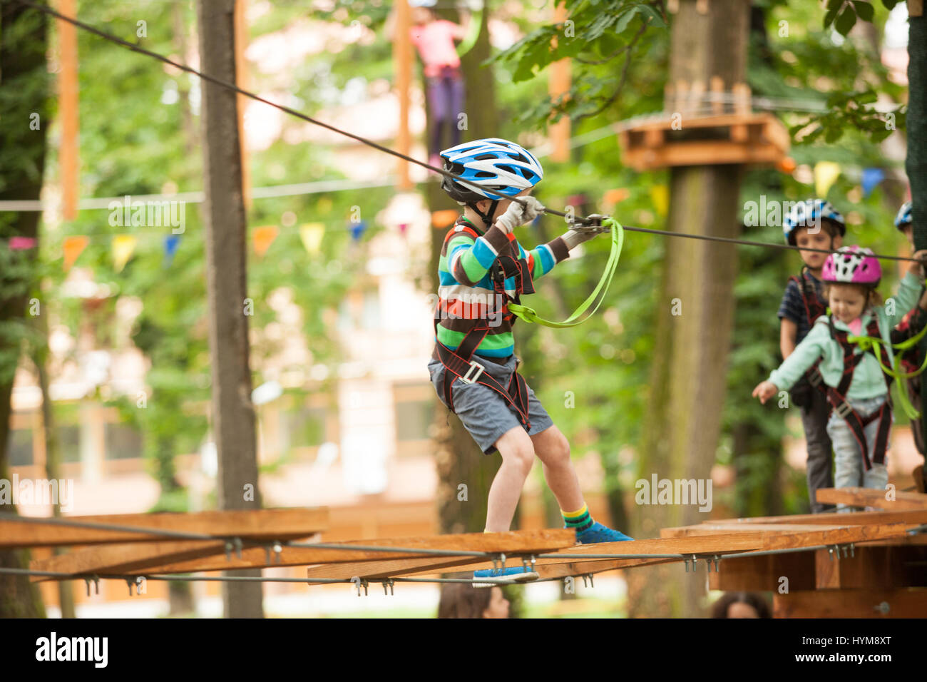 Child in a adventure playground Stock Photo - Alamy