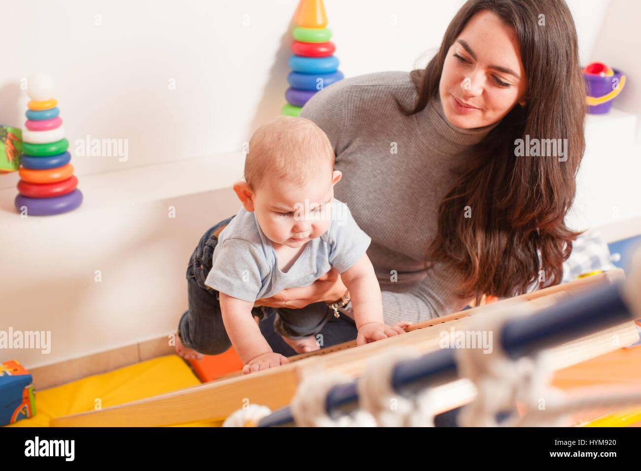 Interaction between mother and baby Stock Photo - Alamy