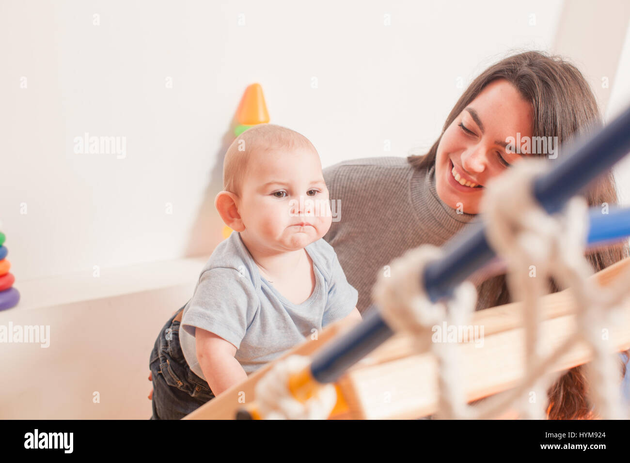 Interaction between mother and baby Stock Photo - Alamy