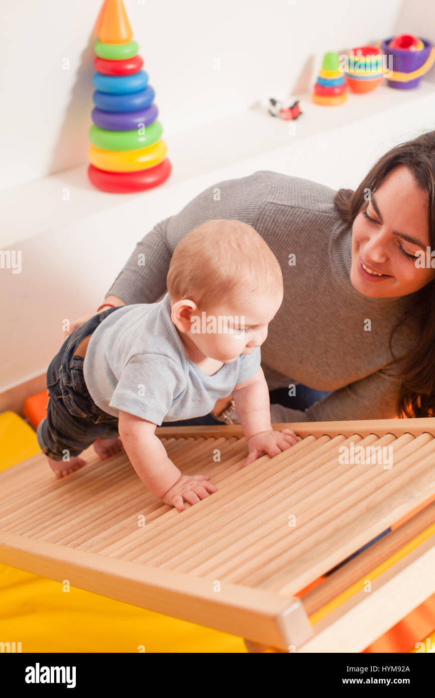 Interaction between mother and baby Stock Photo - Alamy