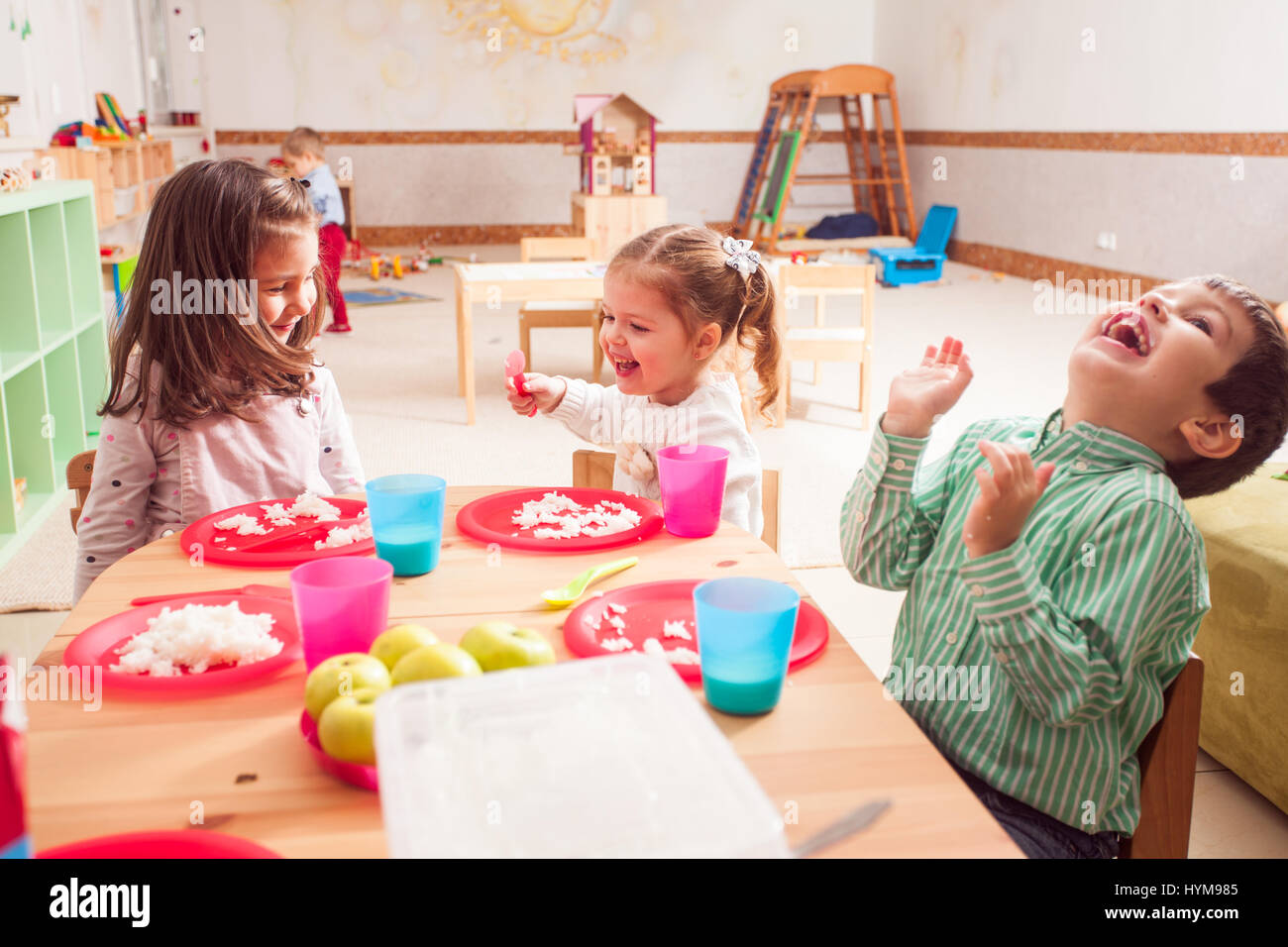 Time to eat in kindergarten Stock Photo - Alamy