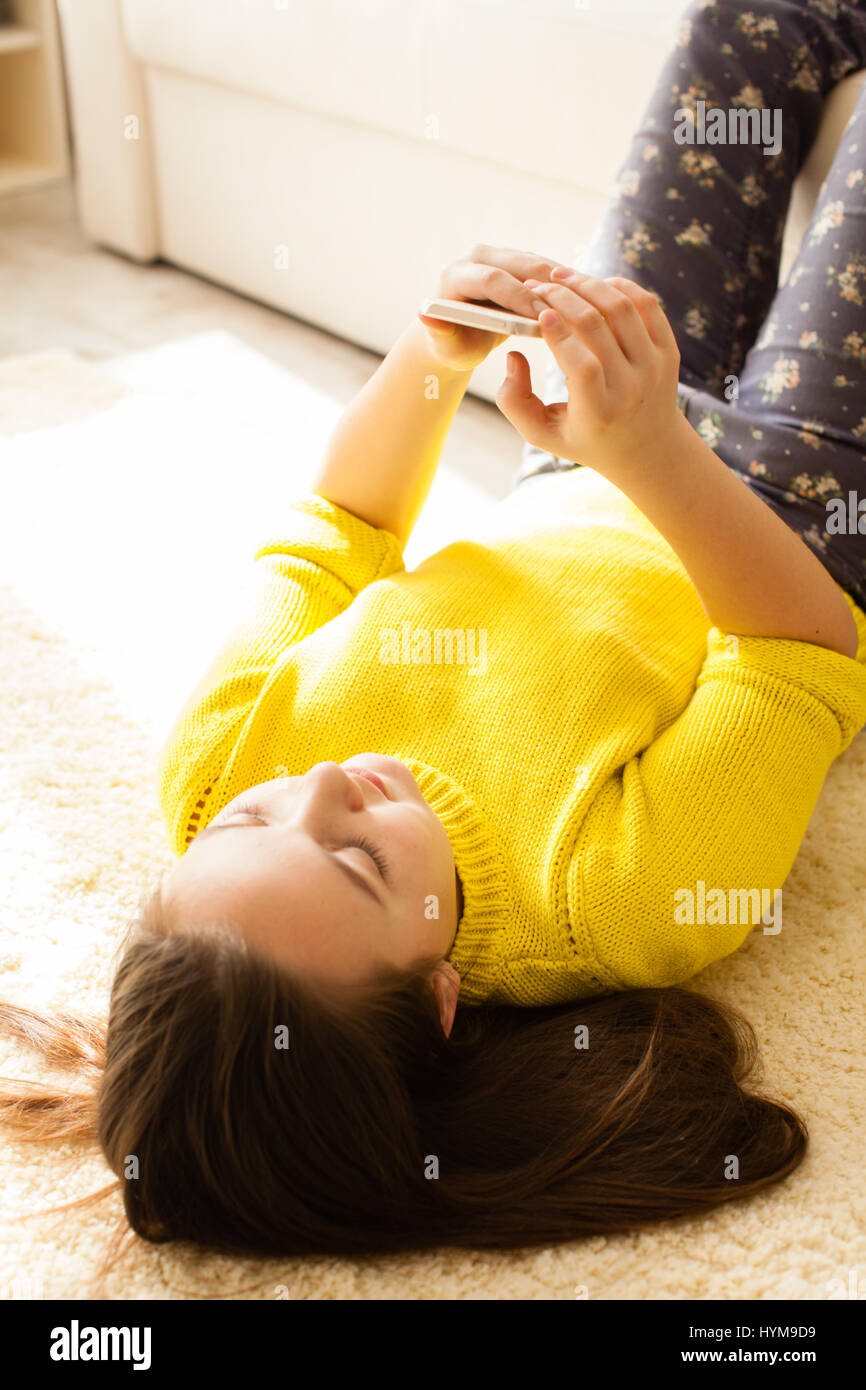 Girl looking at smartphone Stock Photo - Alamy