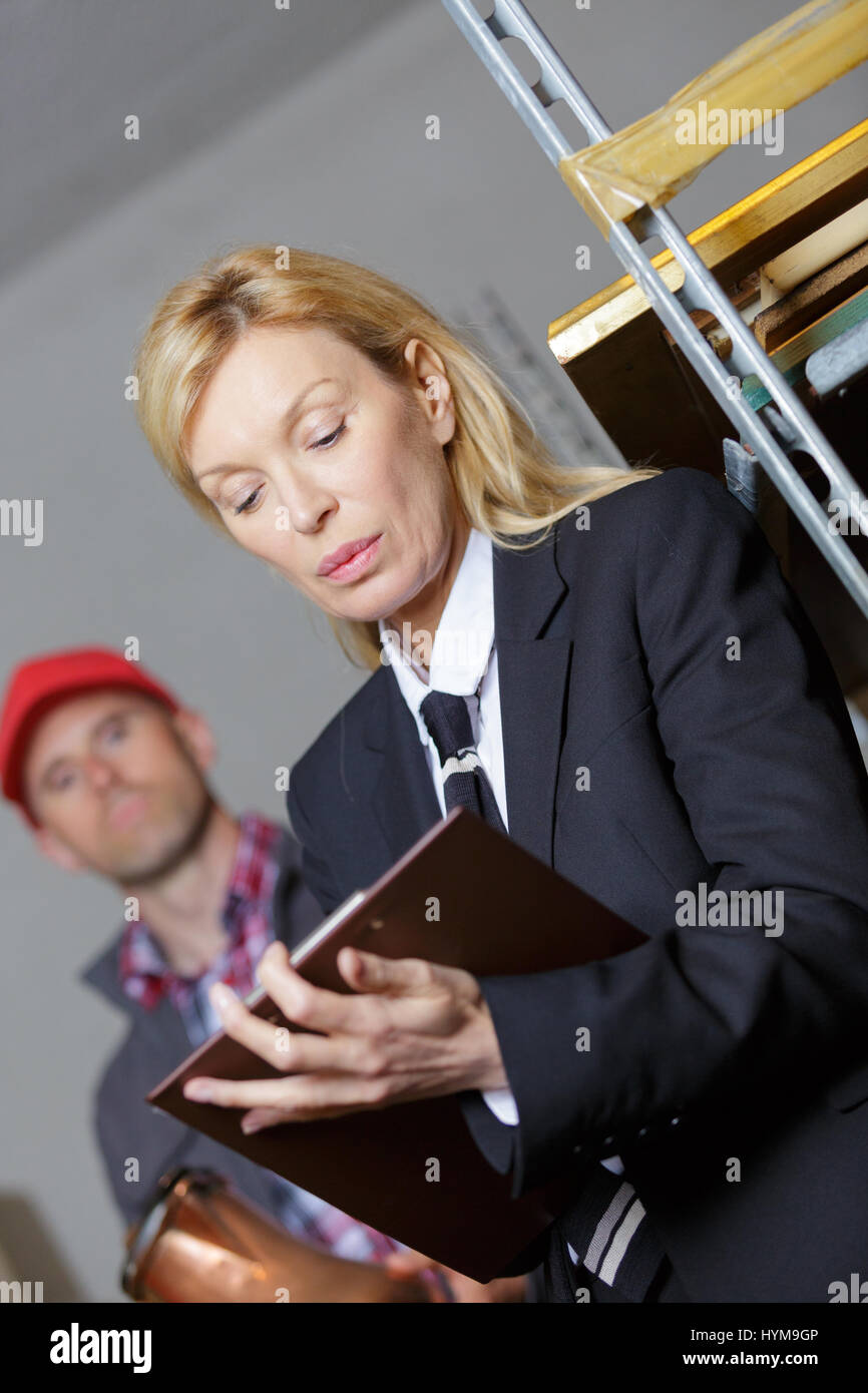 inspector writing notes Stock Photo - Alamy