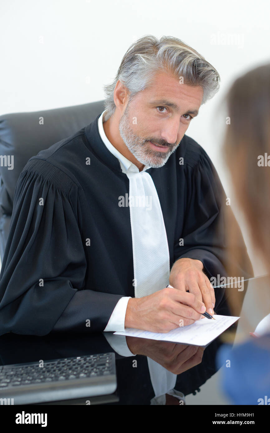 judge writing notes Stock Photo - Alamy