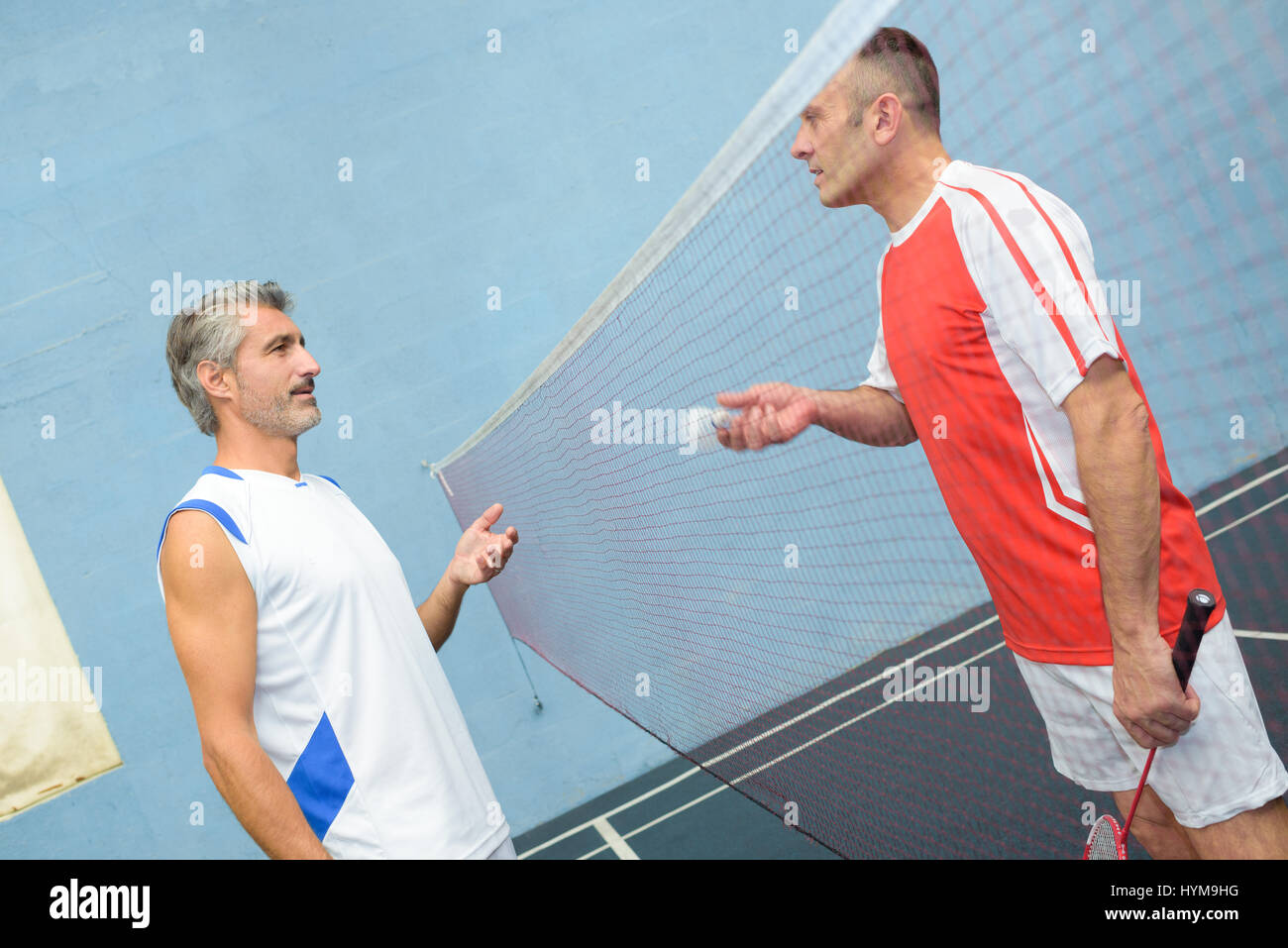Men on badminton court Stock Photo - Alamy
