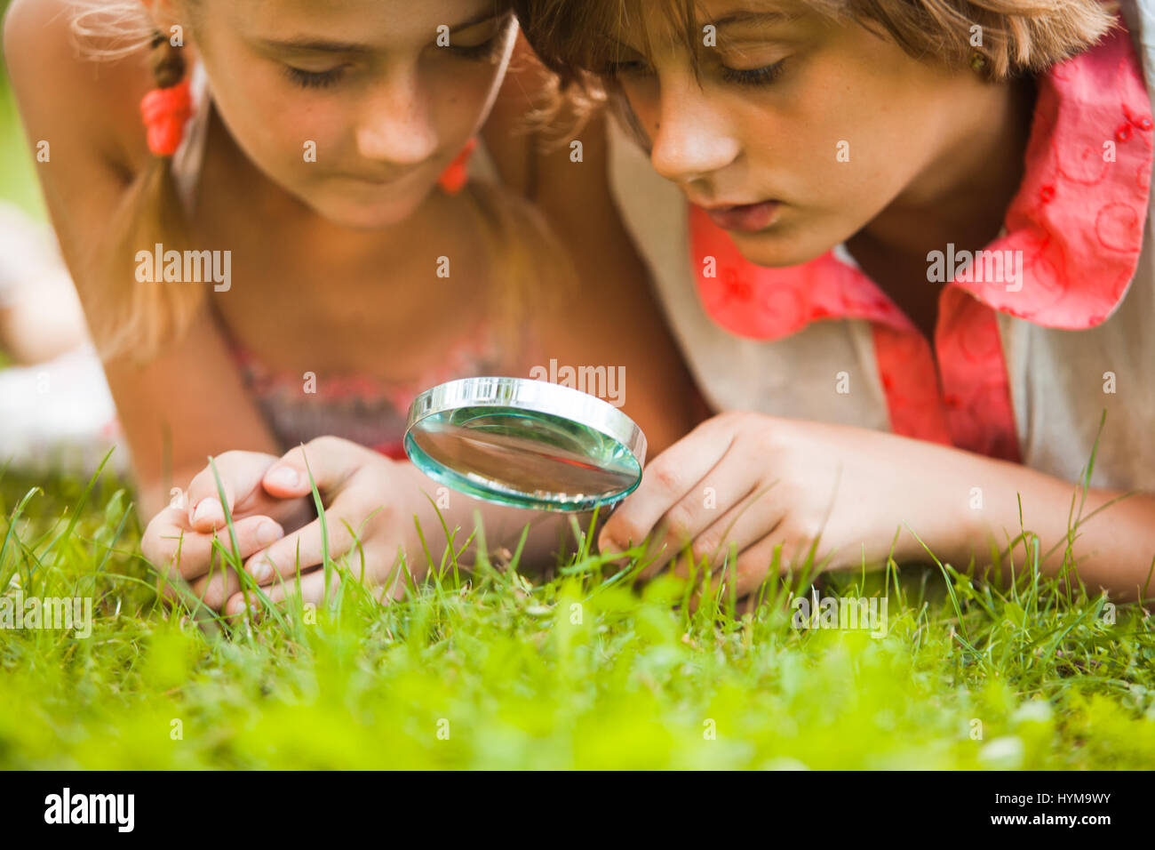 Kid with magnifying glass Stock Photo - Alamy