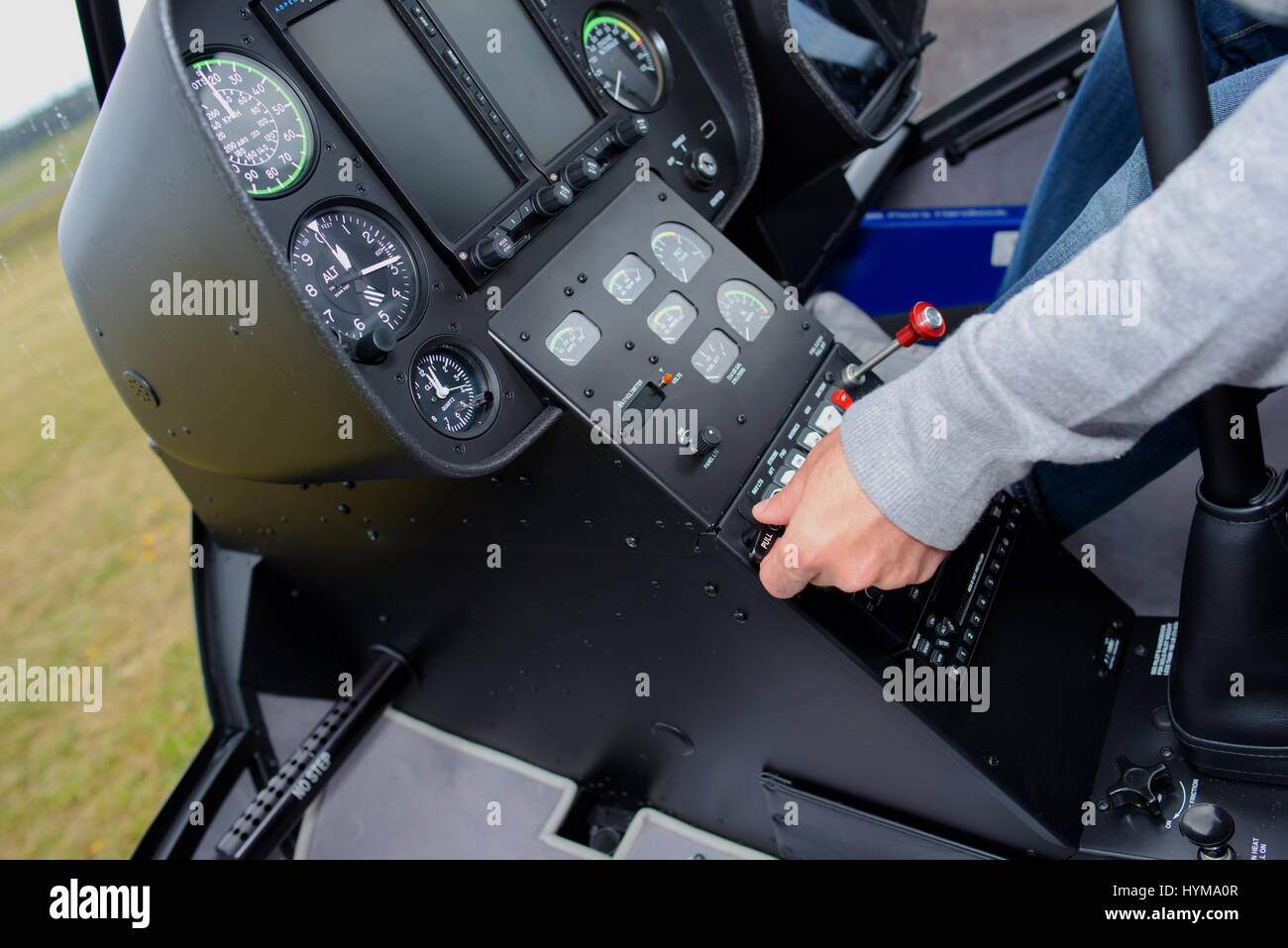 Hand adjusting cockpit controls Stock Photo - Alamy