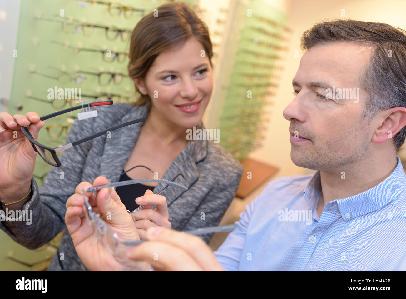 comparing the eyeglasses Stock Photo - Alamy