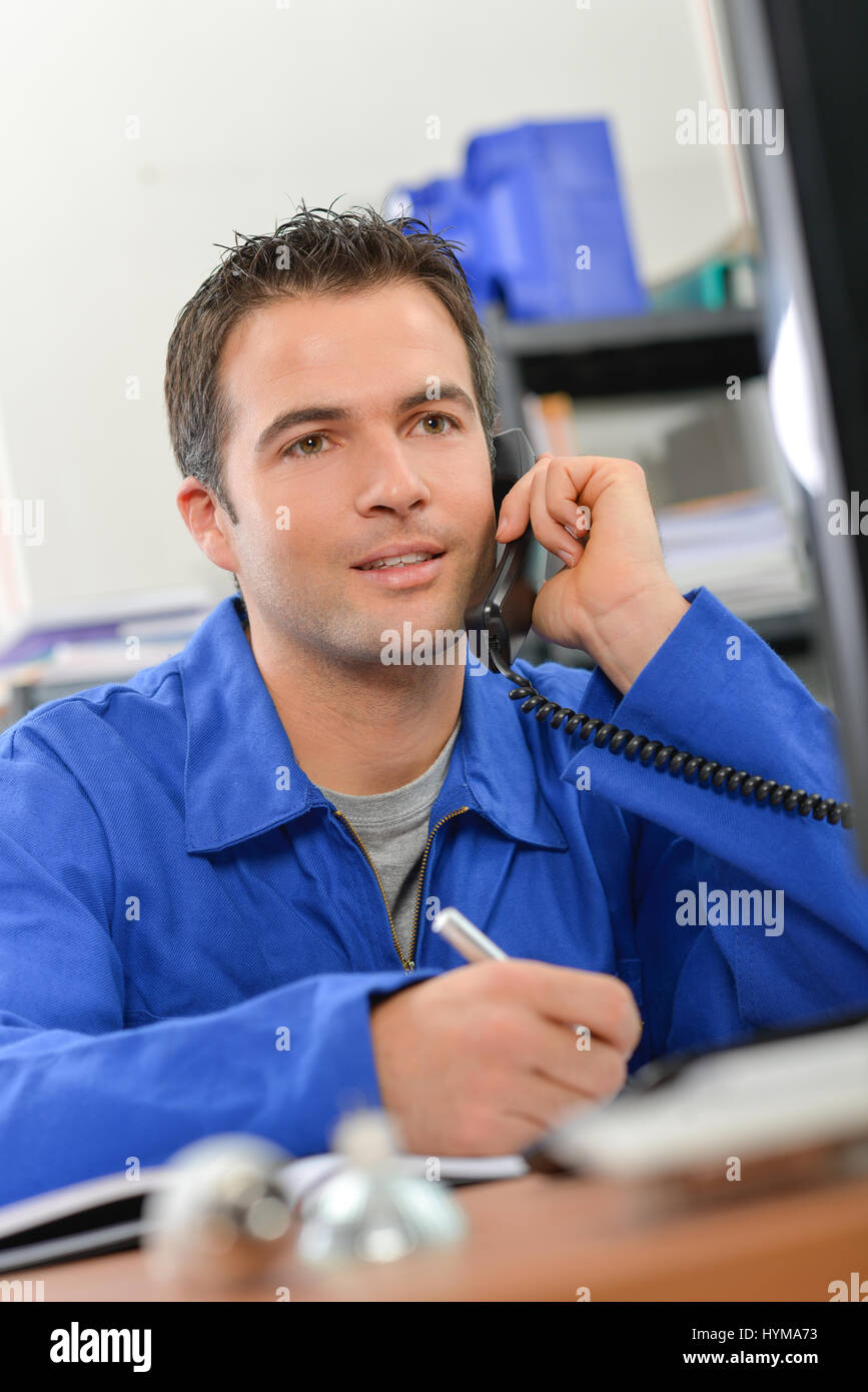 Taking notes during phone conversation hi-res stock photography and ...