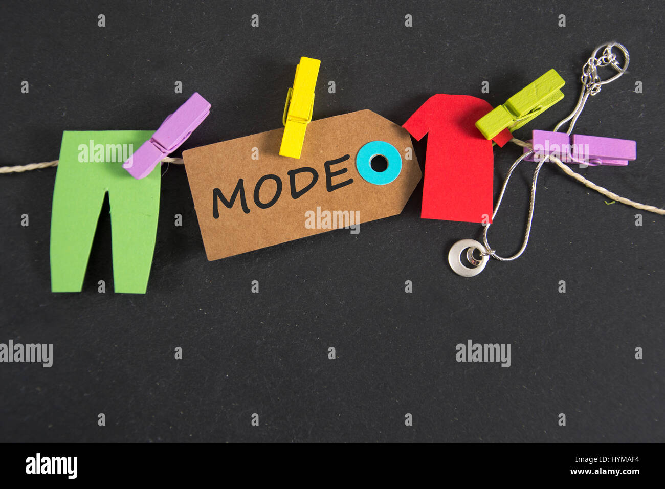 Mode inscription written on paper tag Stock Photo - Alamy