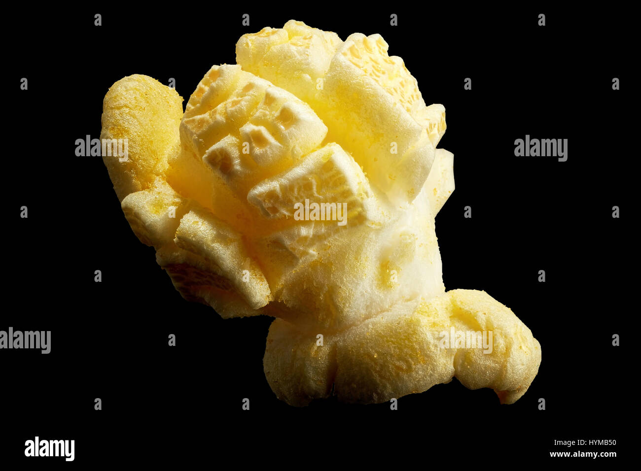 Popped popcorn isolated on a black background Stock Photo - Alamy