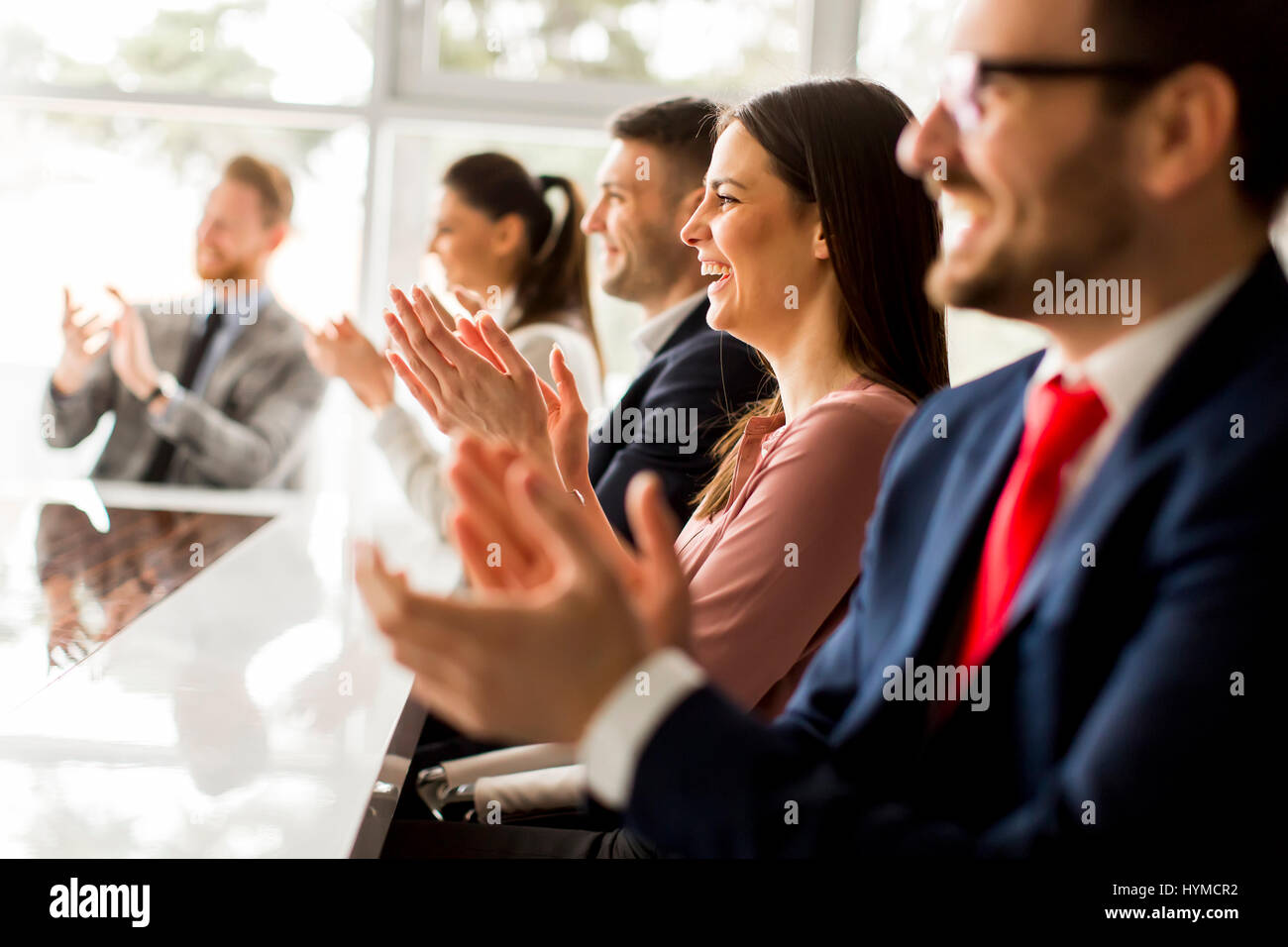 Businesspeople clapping in office hi-res stock photography and images ...