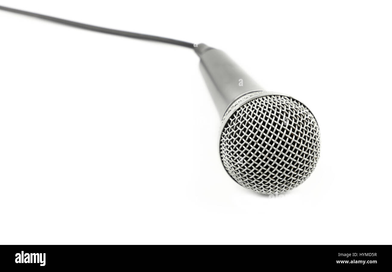 Black and silver vocal microphone with cable high angle view close up ...