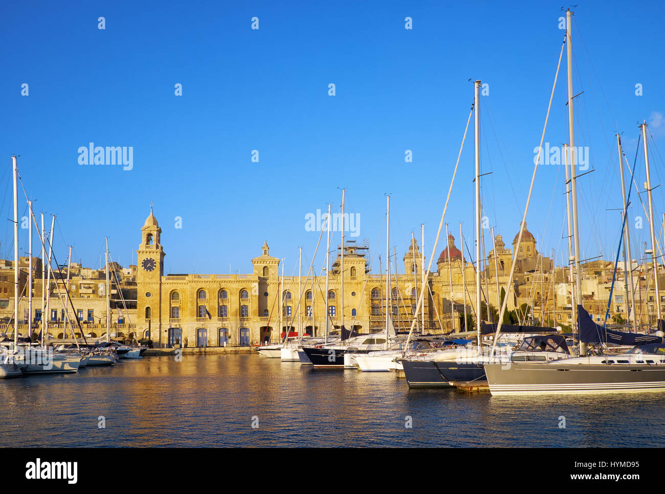 The yachts and boats moored in the harbor in Dockyard creek in front of ...