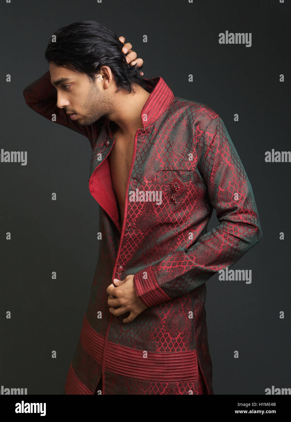 Close up portrait of a young man in traditional indian clothing with ...