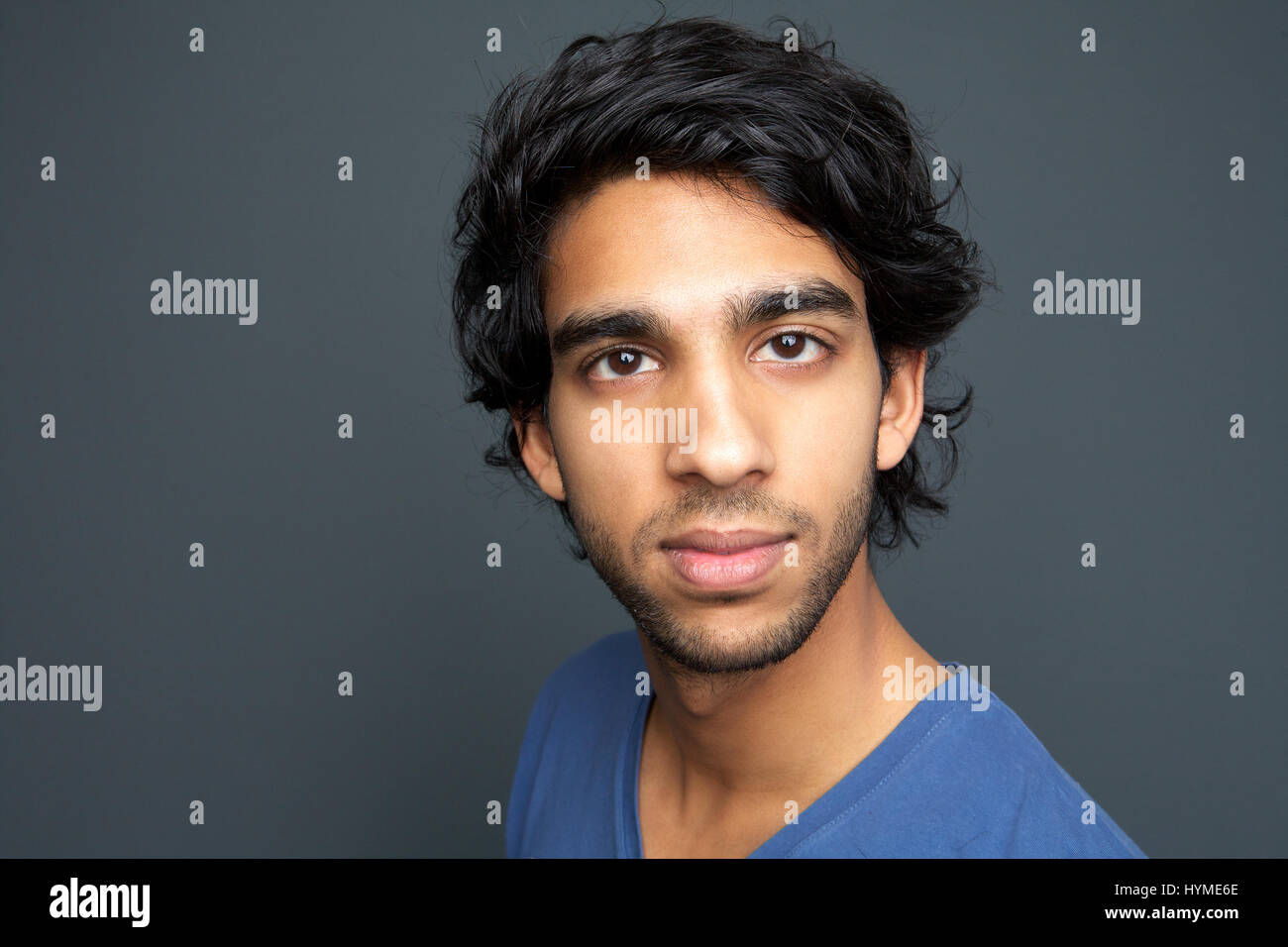 Horizontal close up portrait of a young man staring Stock Photo - Alamy