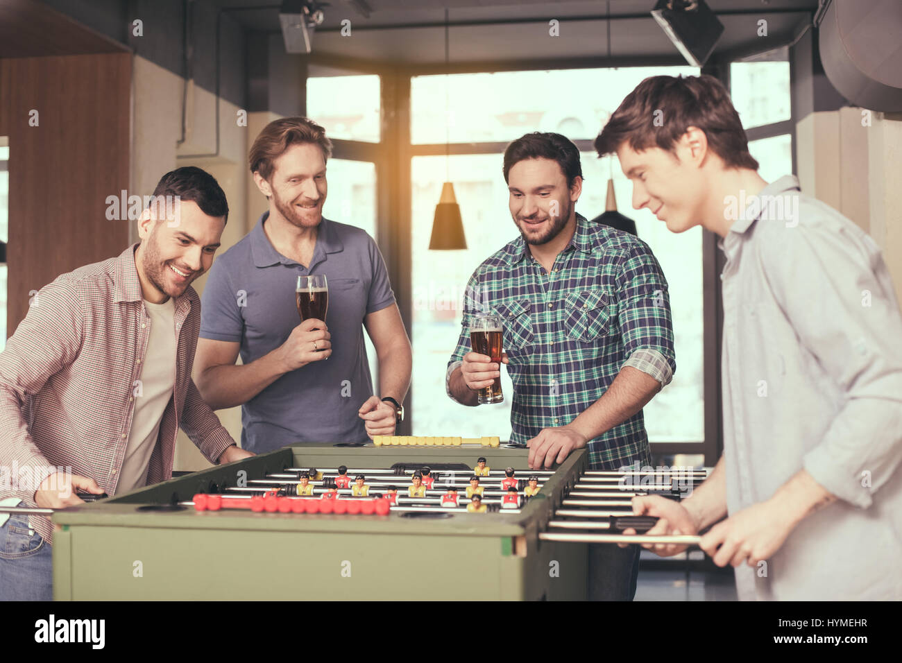 Friends having fun in pub Stock Photo - Alamy